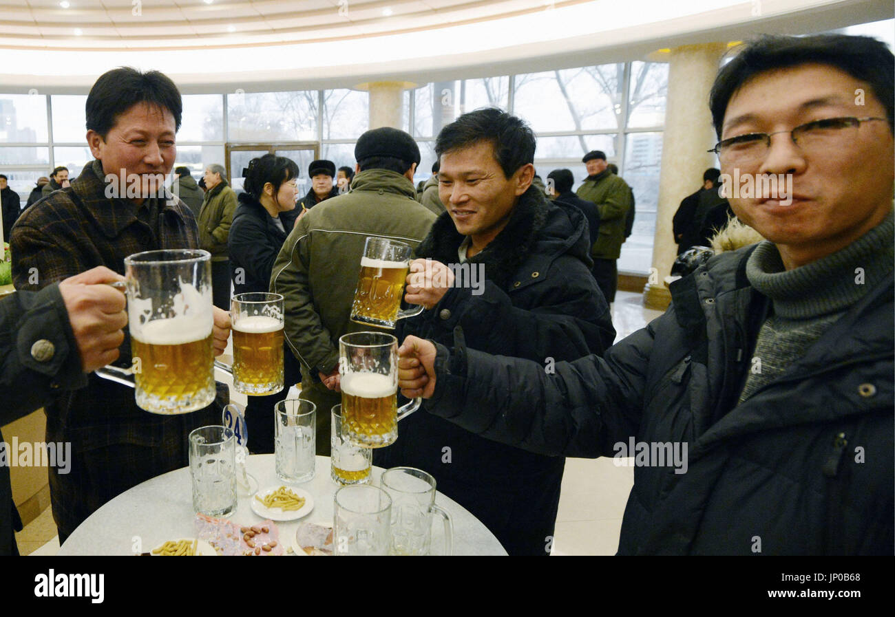 BEIJING, China - People enjoy draft beer at the Mansugyo Soft Drink ...
