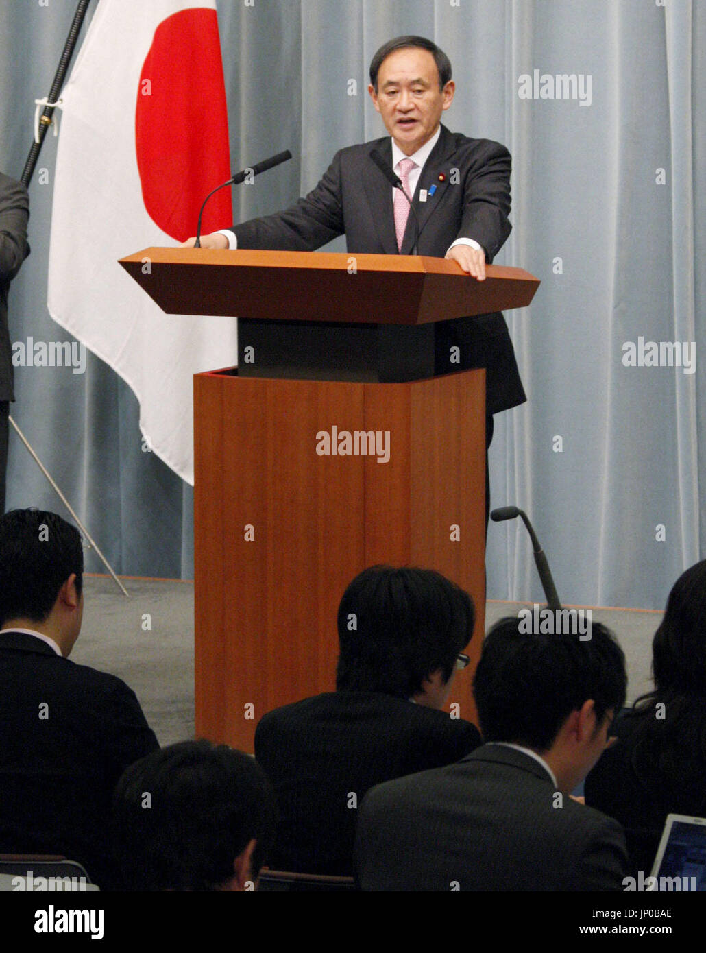 TOKYO, Japan - Chief Cabinet Secretary Yoshihide Suga tells a press ...