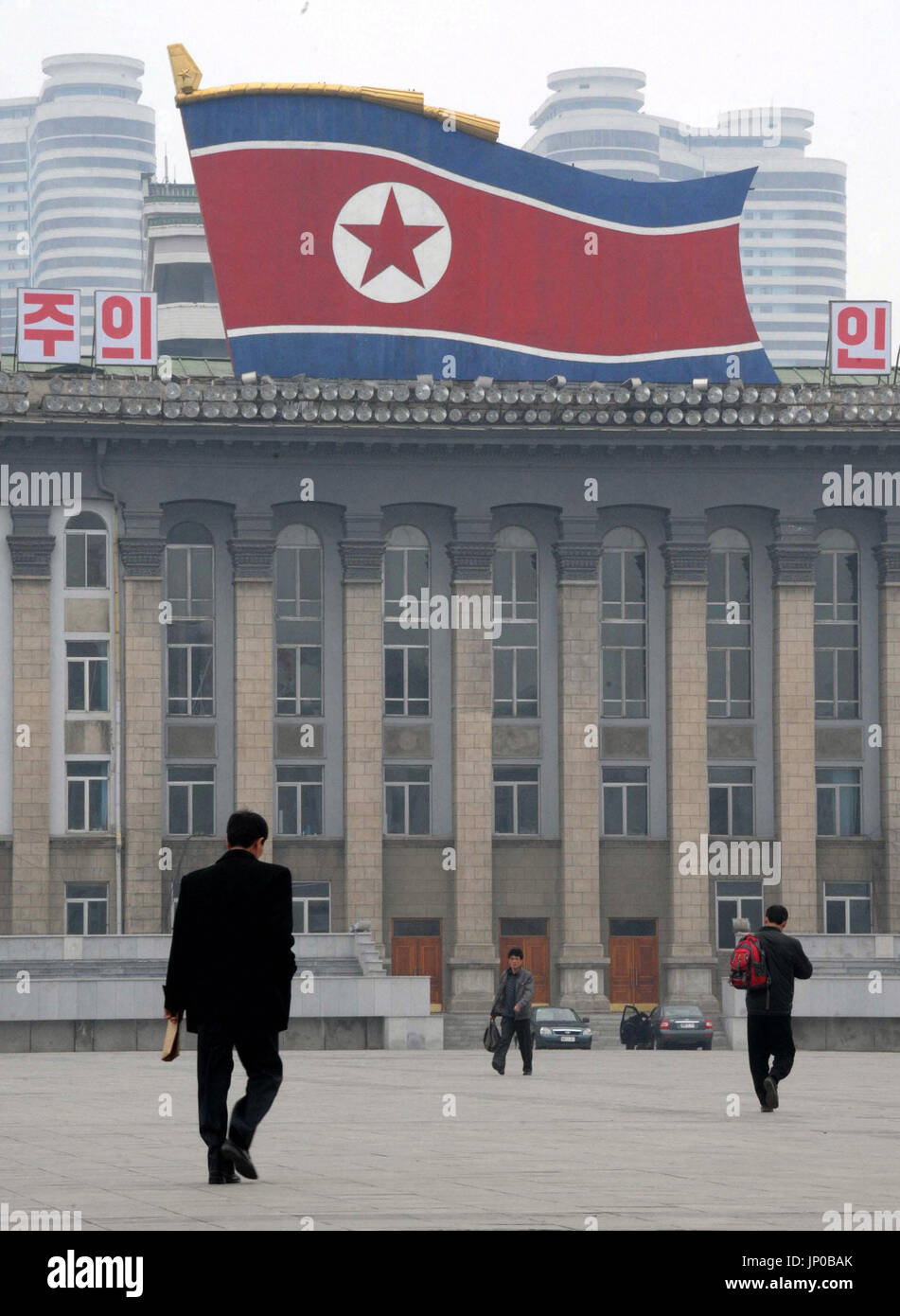 PYONGYANG, North Korea - North Koreans walk in Kim Il Sung Square, the ...