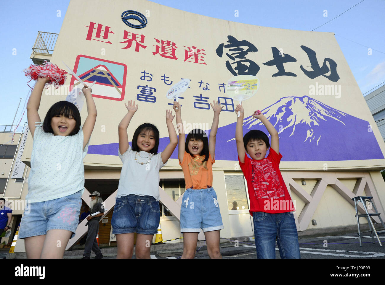 FUJIYOSHIDA, Japan - Children celebrate in front of a painting of Mt ...