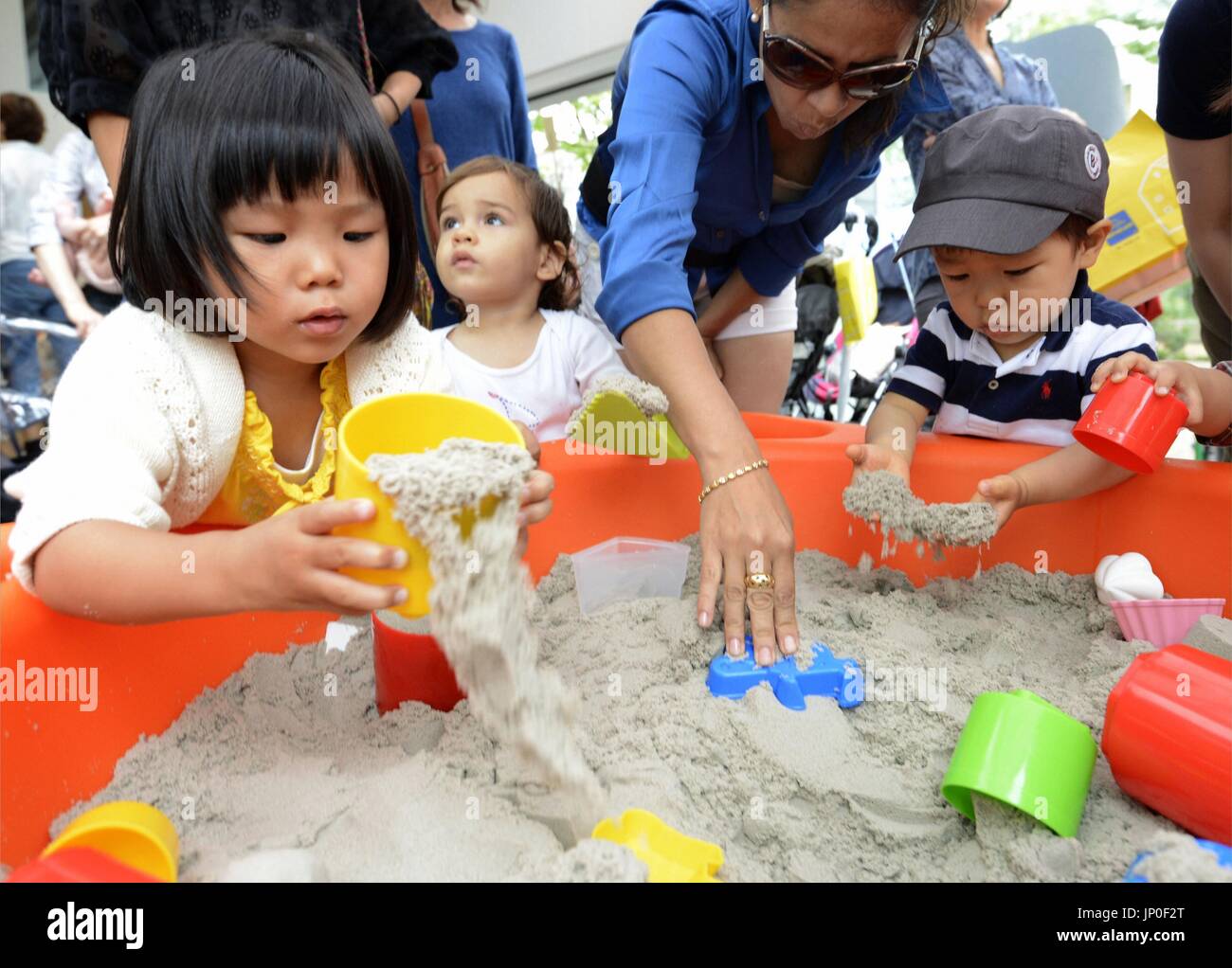 TOKYO, Japan - Children play with the "Dancing Sand" kit specifically ...
