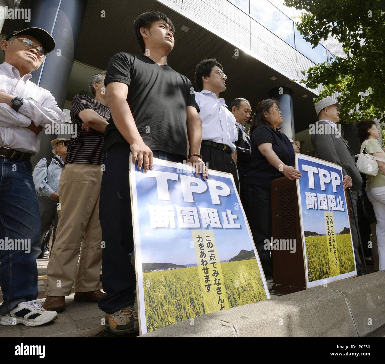 SAPPORO, Japan - Voters hold signs expressing opposition to Japan's ...