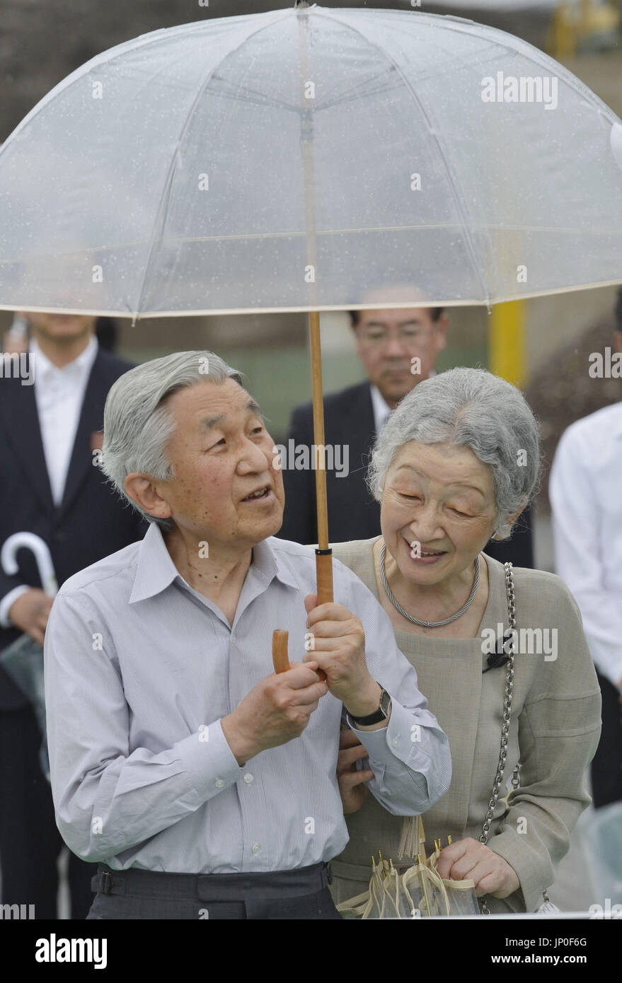 OFUNATO, Japan - Emperor Akihito (L) and Empress Michiko are seen ...