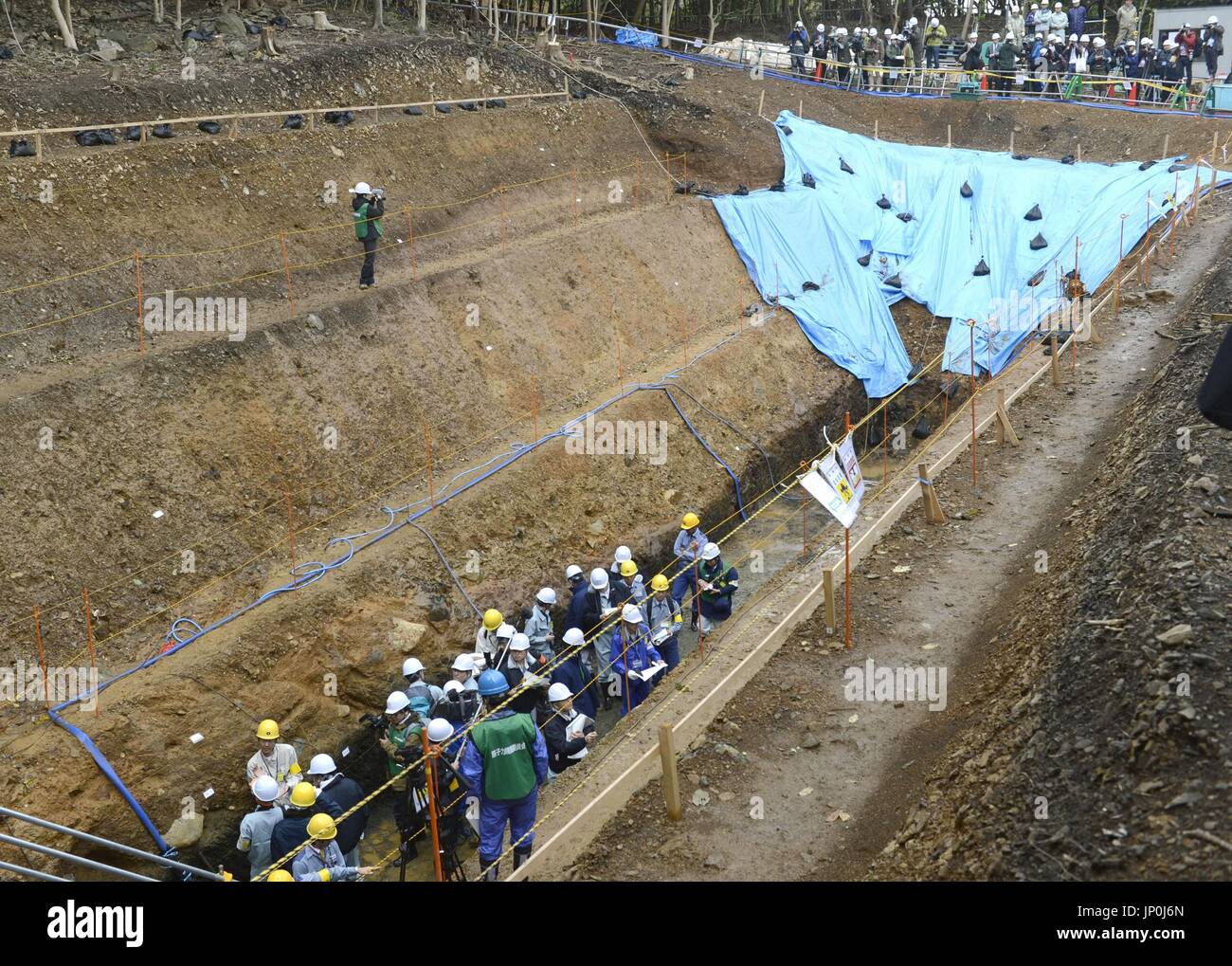 OI, Japan - A team from the Nuclear Regulation Authority examines a ...