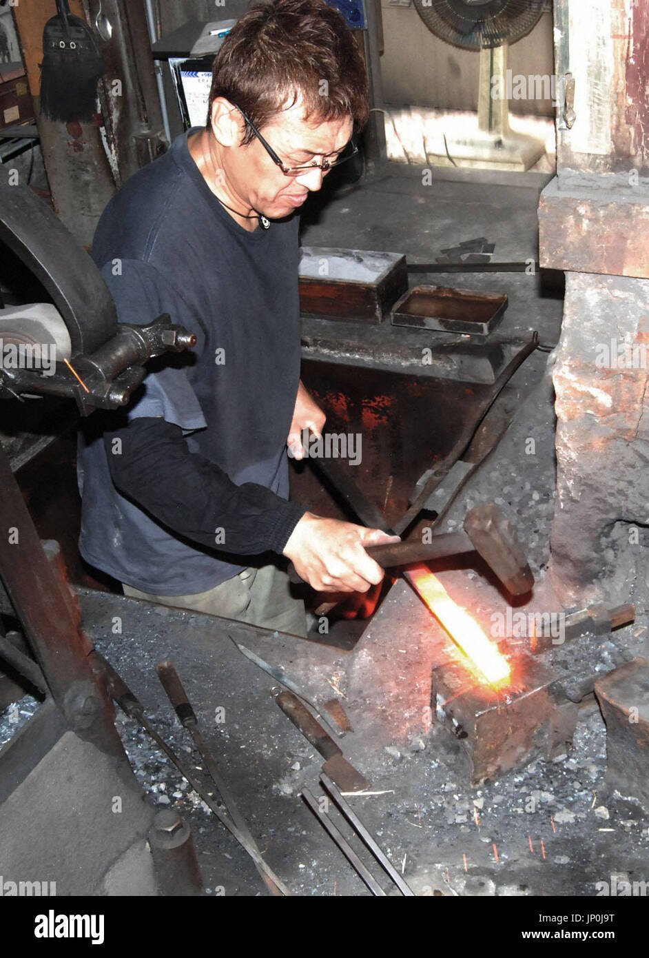 OSAKA, Japan - Tadashi Enami, a craftsman of Sakai forged blades ...
