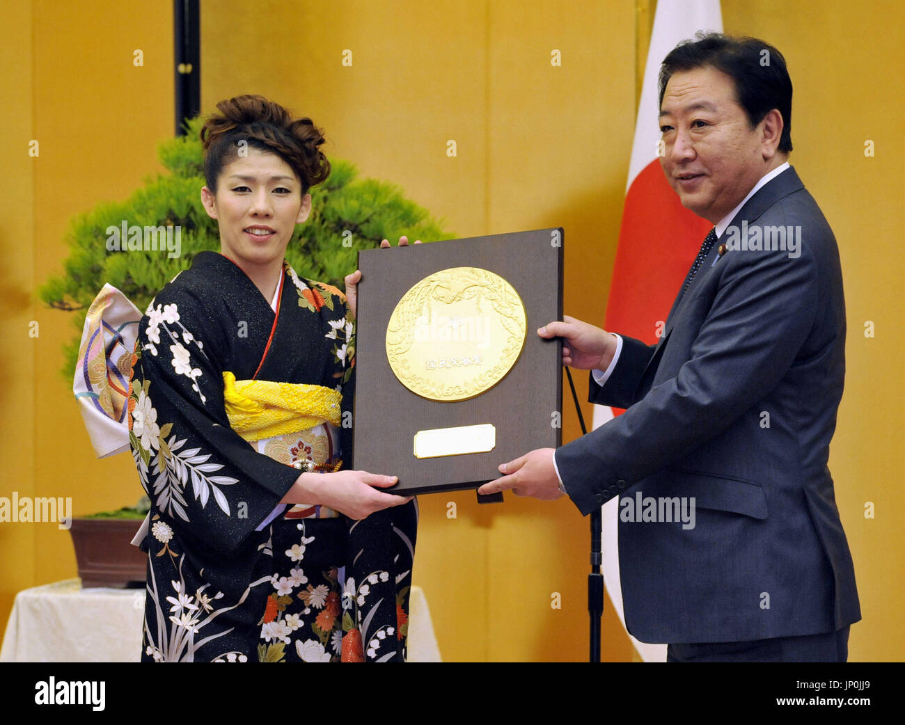 TOKYO, Japan - Three-time Olympic wrestling champion Saori Yoshida (L ...