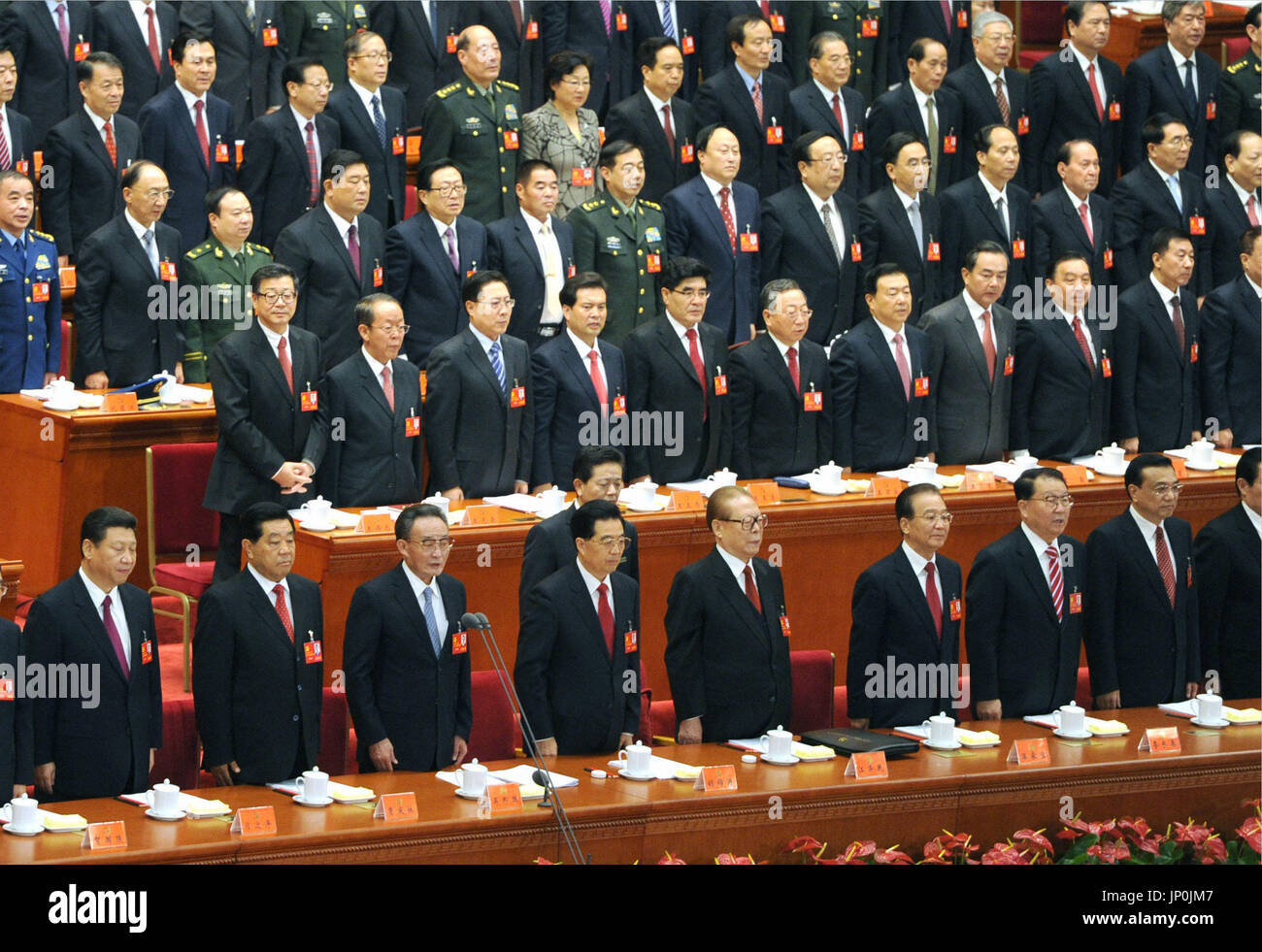 BEIJING, China - Attendees sing China's national anthem during the ...