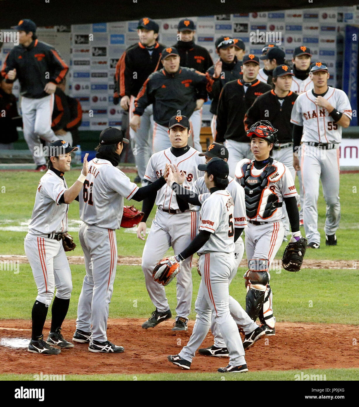 BUSAN, South Korea - Members of the Japanese pro baseball Yomiuri Giants celebrate after ...