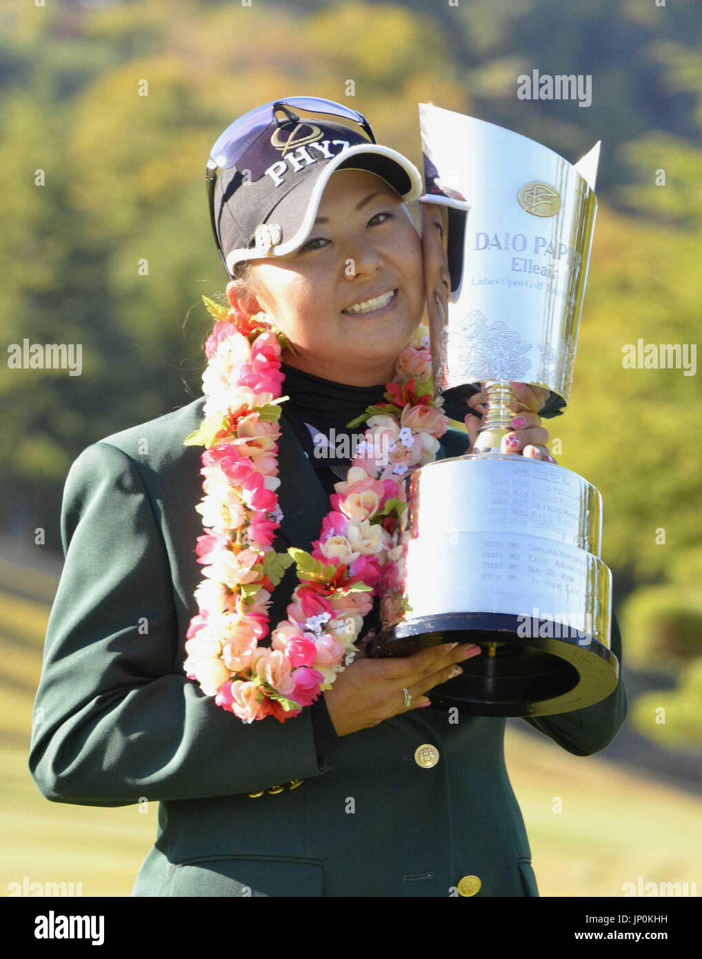 IWAKI, Japan - Japan's Miki Saiki holds the victor's trophy after ...