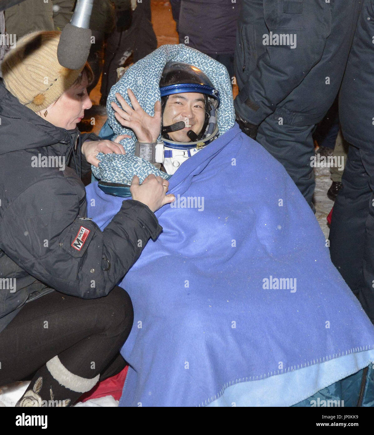 ARKALYK, Kazakhstan - Japanese astronaut Akihiko Hoshide waves after he ...