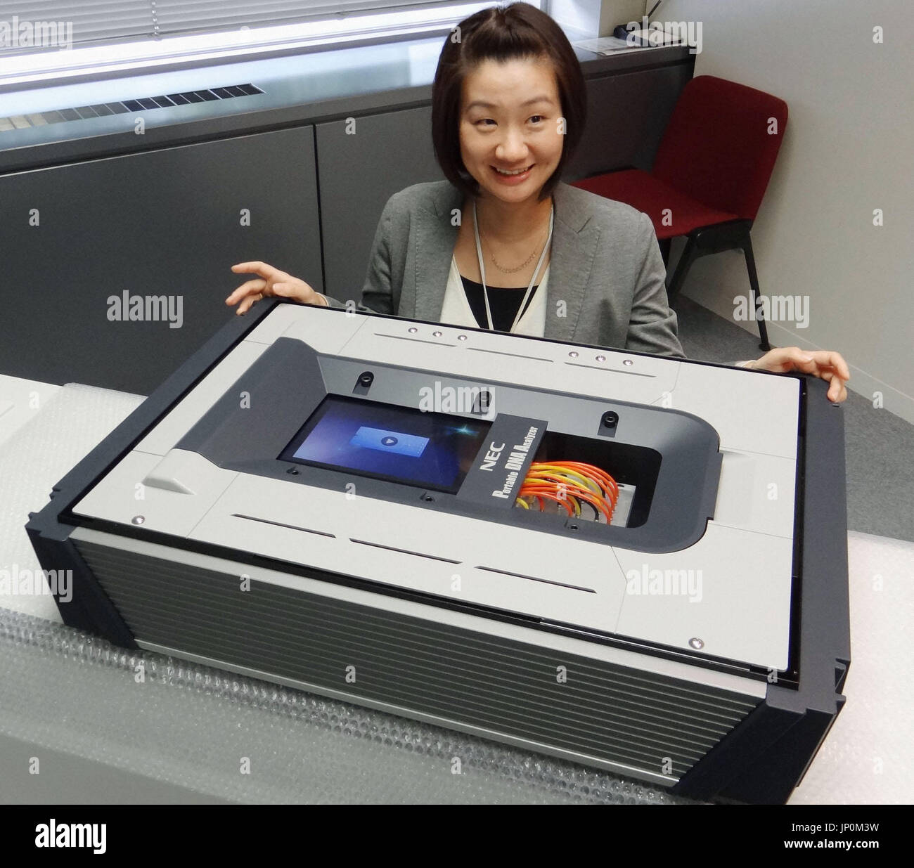 TOKYO, Japan - Photo shows a portable DNA analyzer unveiled by NEC Corp ...