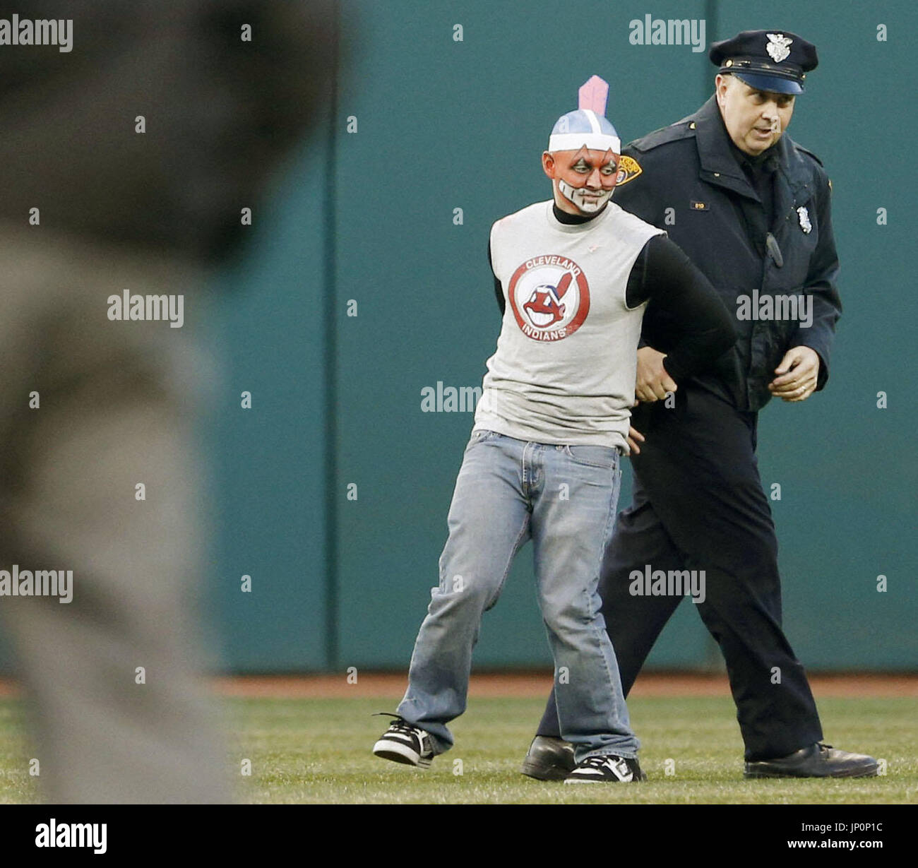 CLEVELAND, United States - A police officer seizes a Cleveland Indians ...