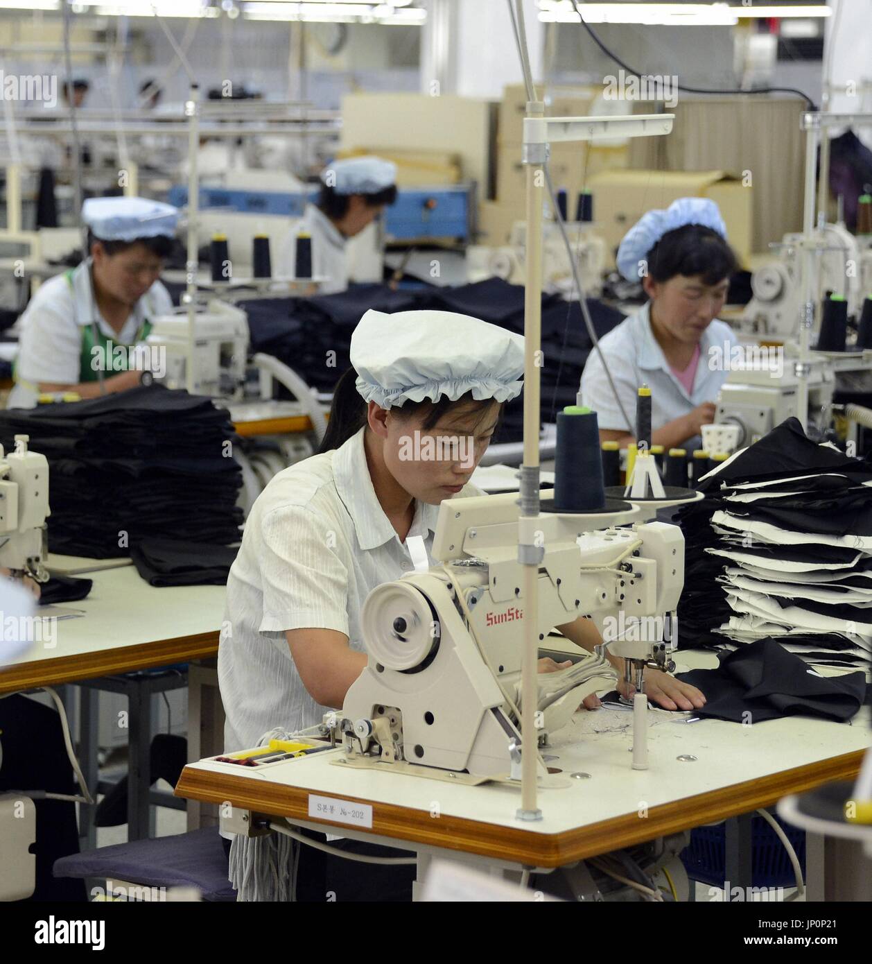 TOKYO, Japan - An October 2012 file photo shows workers at a garment ...