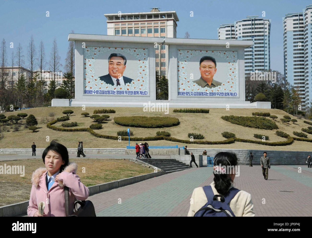PYONGYANG, North Korea - People walk near huge portraits of North ...