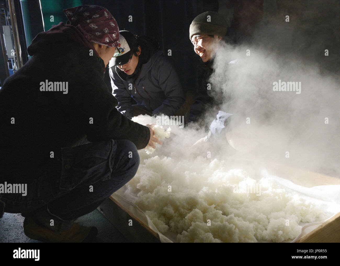 NAGOYA, Japan - Employees of Banjo Jozo spread steamed rice with their ...