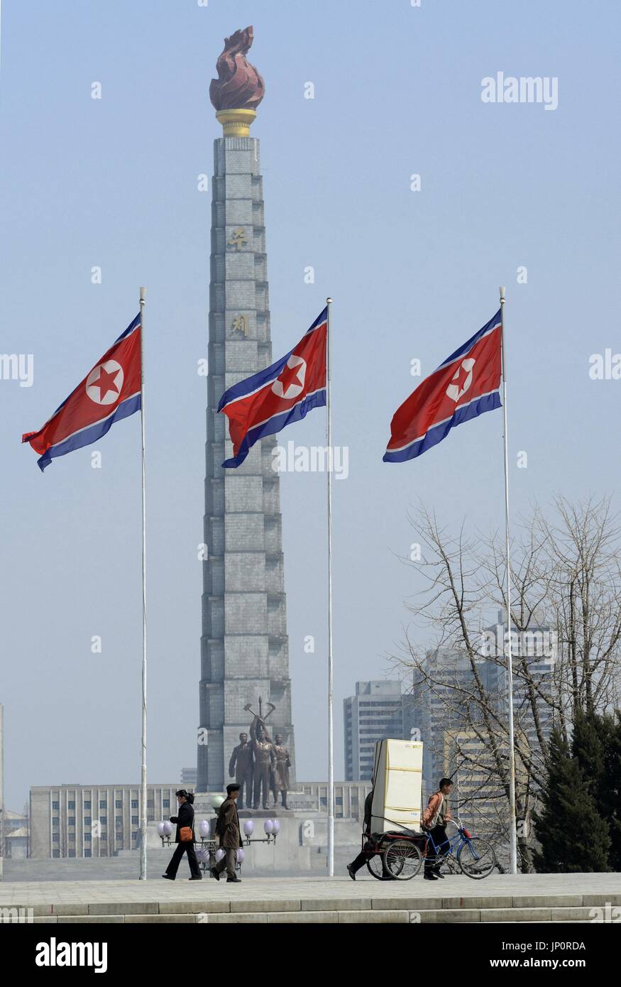 PYONGYANG, North Korea - North Korean flags fly in front of the Tower ...