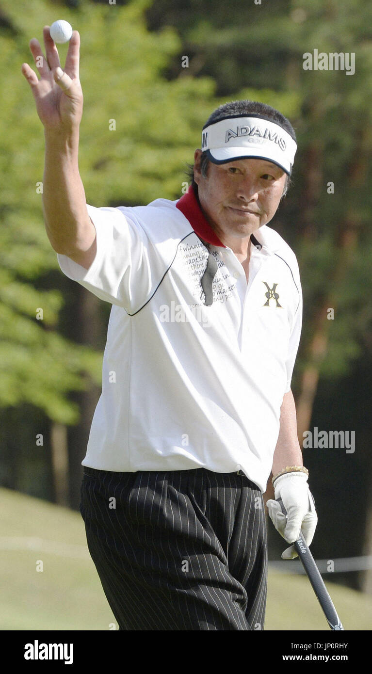 KAWANISHI, Japan - Japanese golfer Masashi "Jumbo" Ozaki holds the ball ...