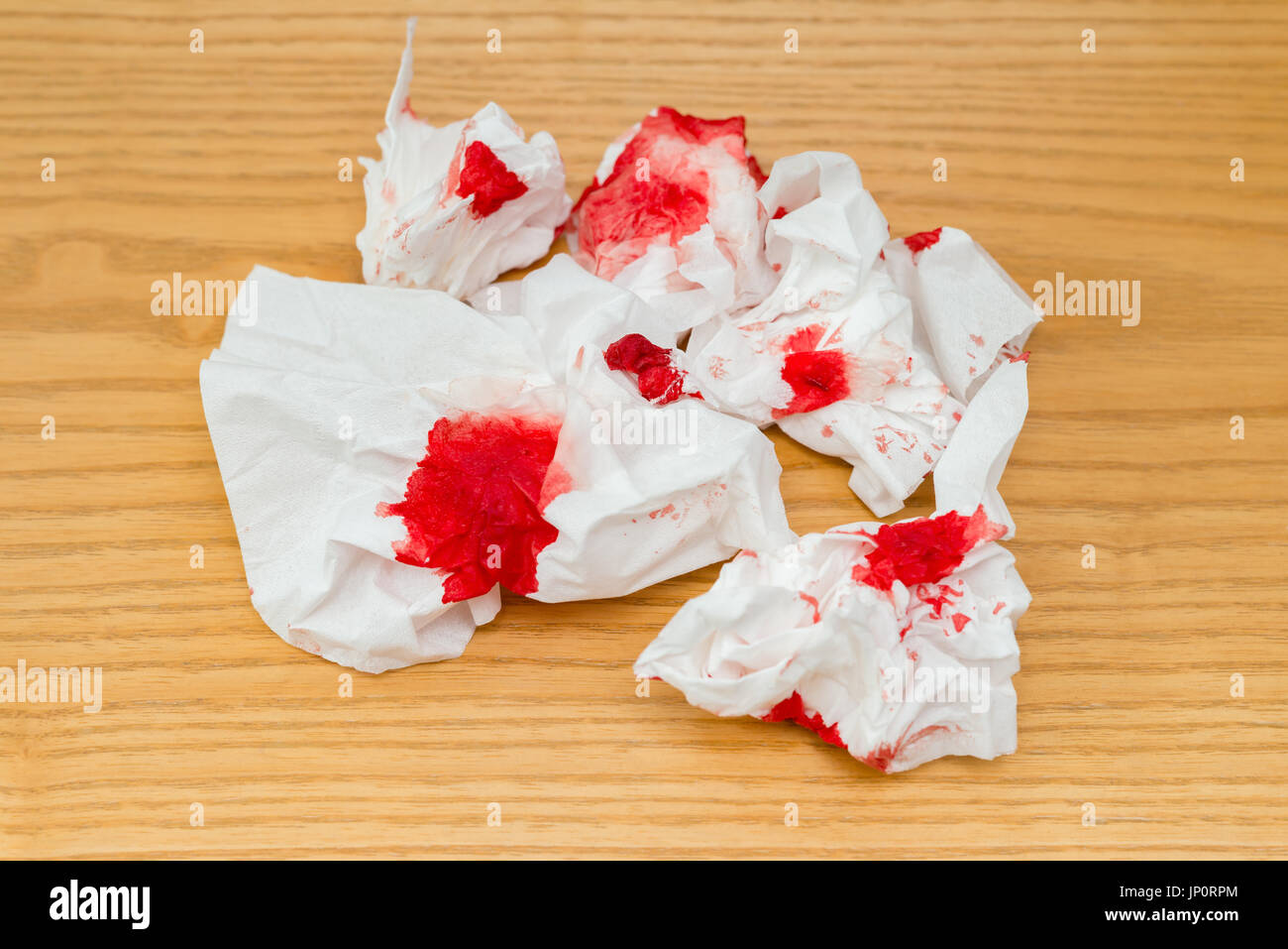 bloody tissue on a wood table Stock Photo - Alamy