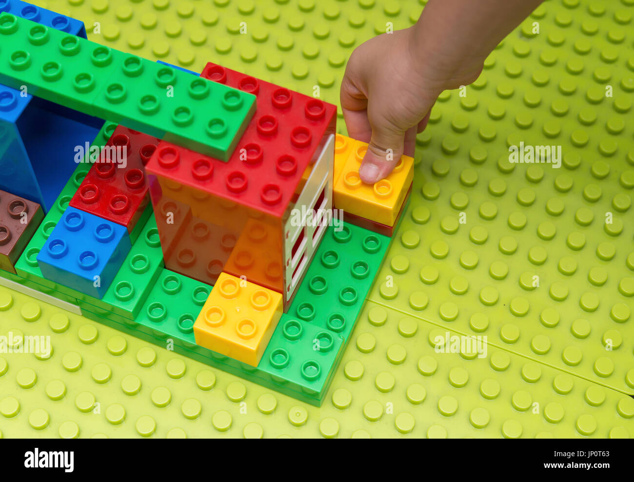kid playing colorful toy blocks Stock Photo - Alamy