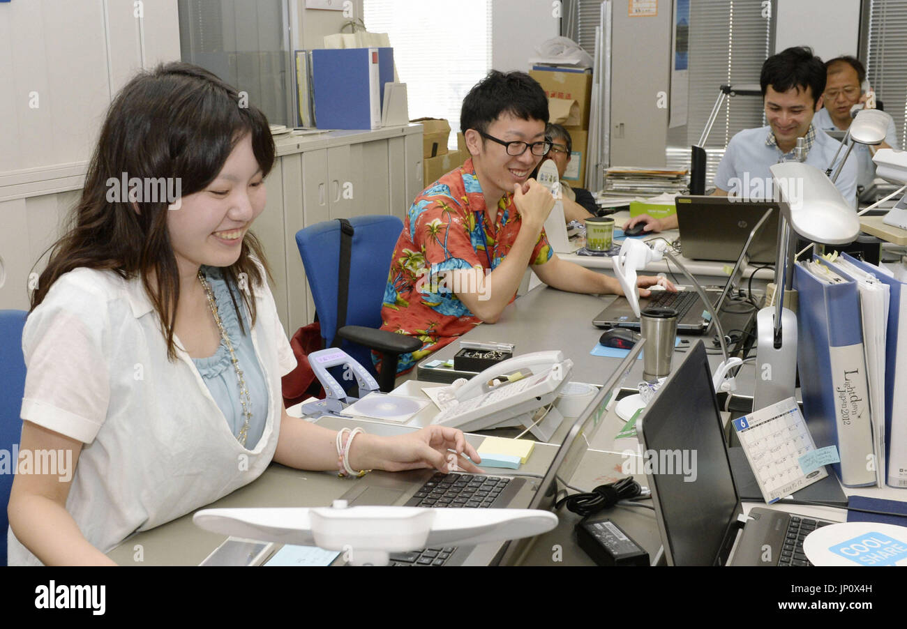 TOKYO, Japan - Employees at the Environment Ministry work in casual ...