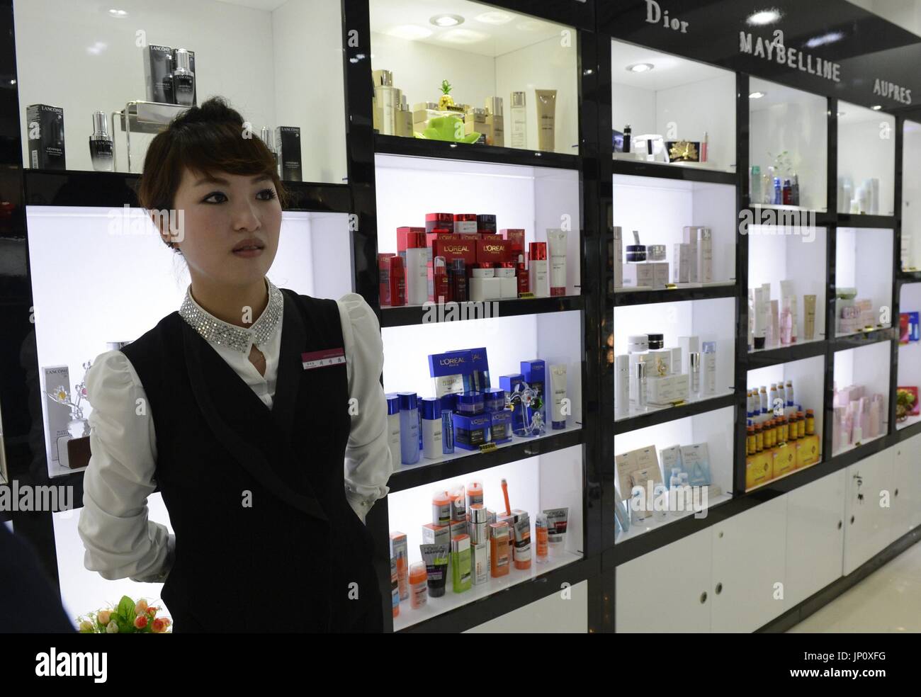 PYONGYANG, North Korea - Photo shows a cosmetics shop and a shopkeeper ...
