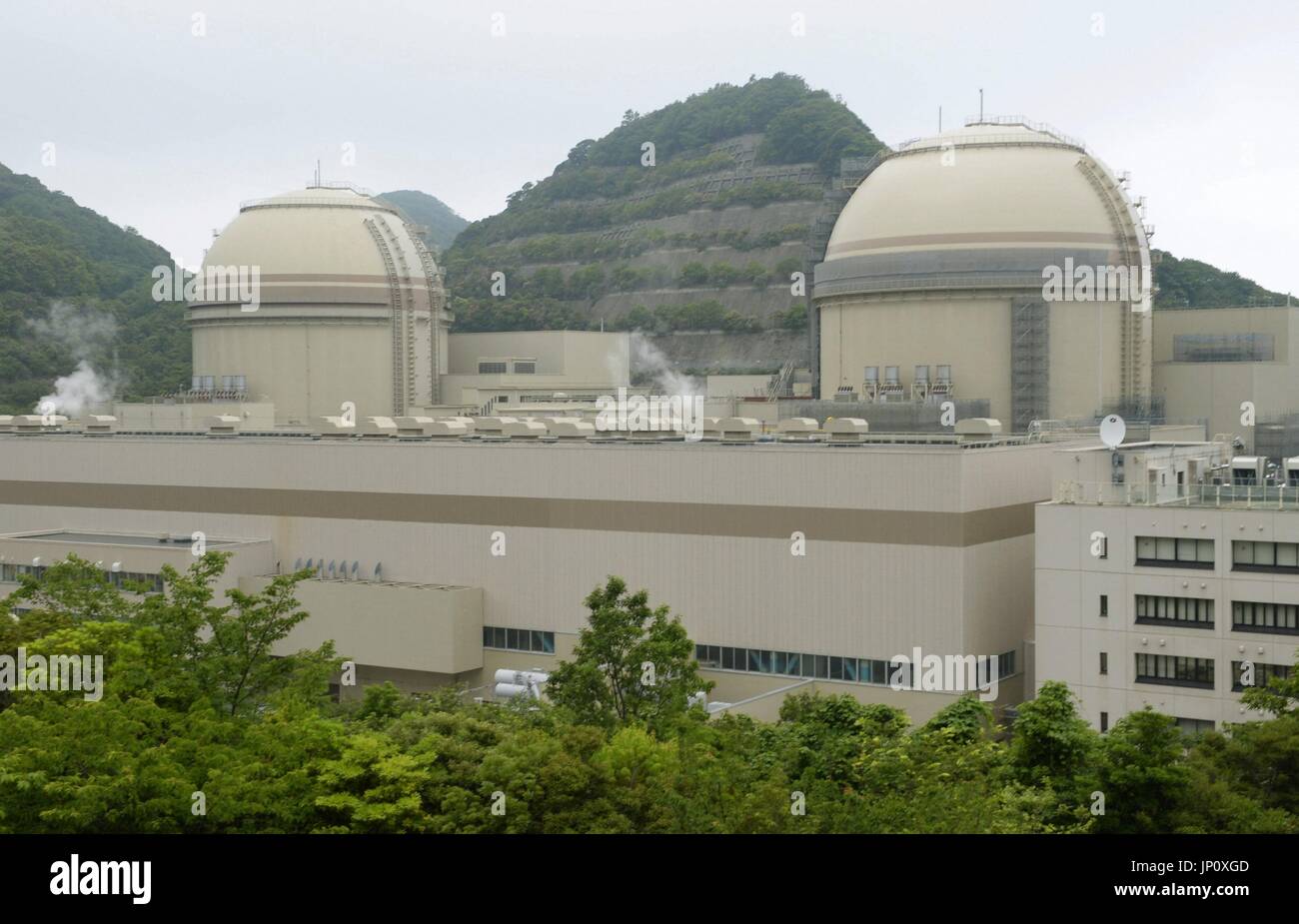 OI, Japan - Photo shows buildings containing the No. 3 reactor (R) and ...