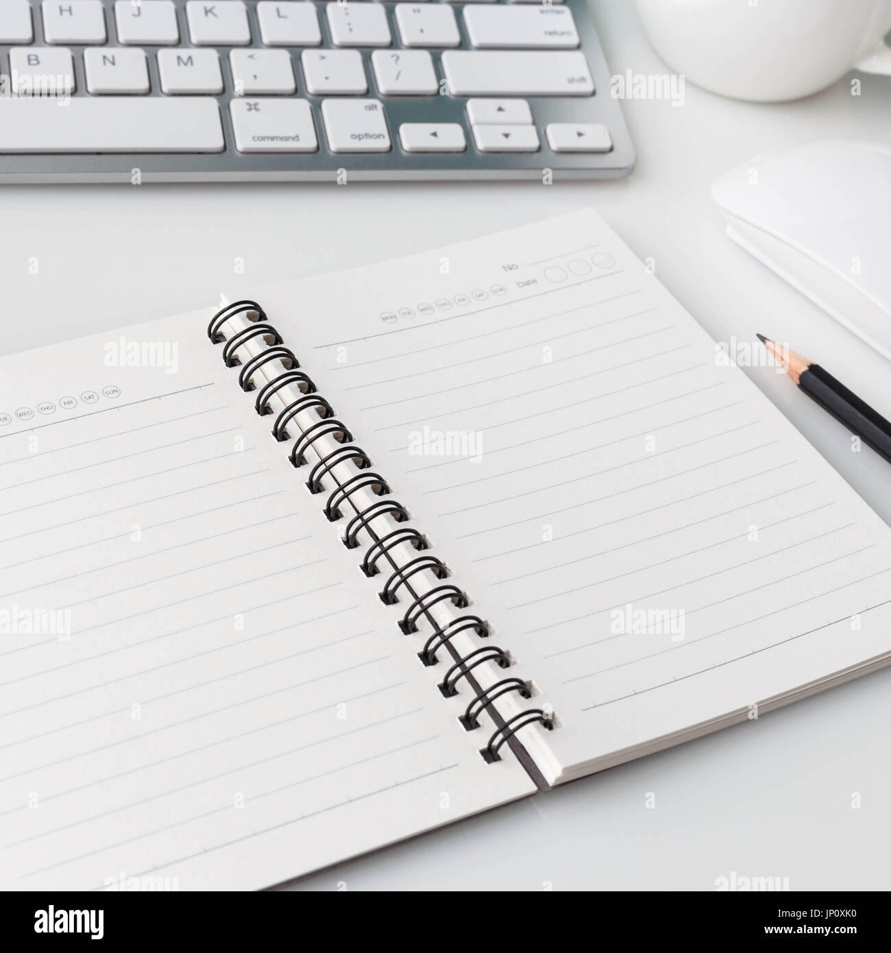 Modern white office desk top table with computer laptop, notebook and ...