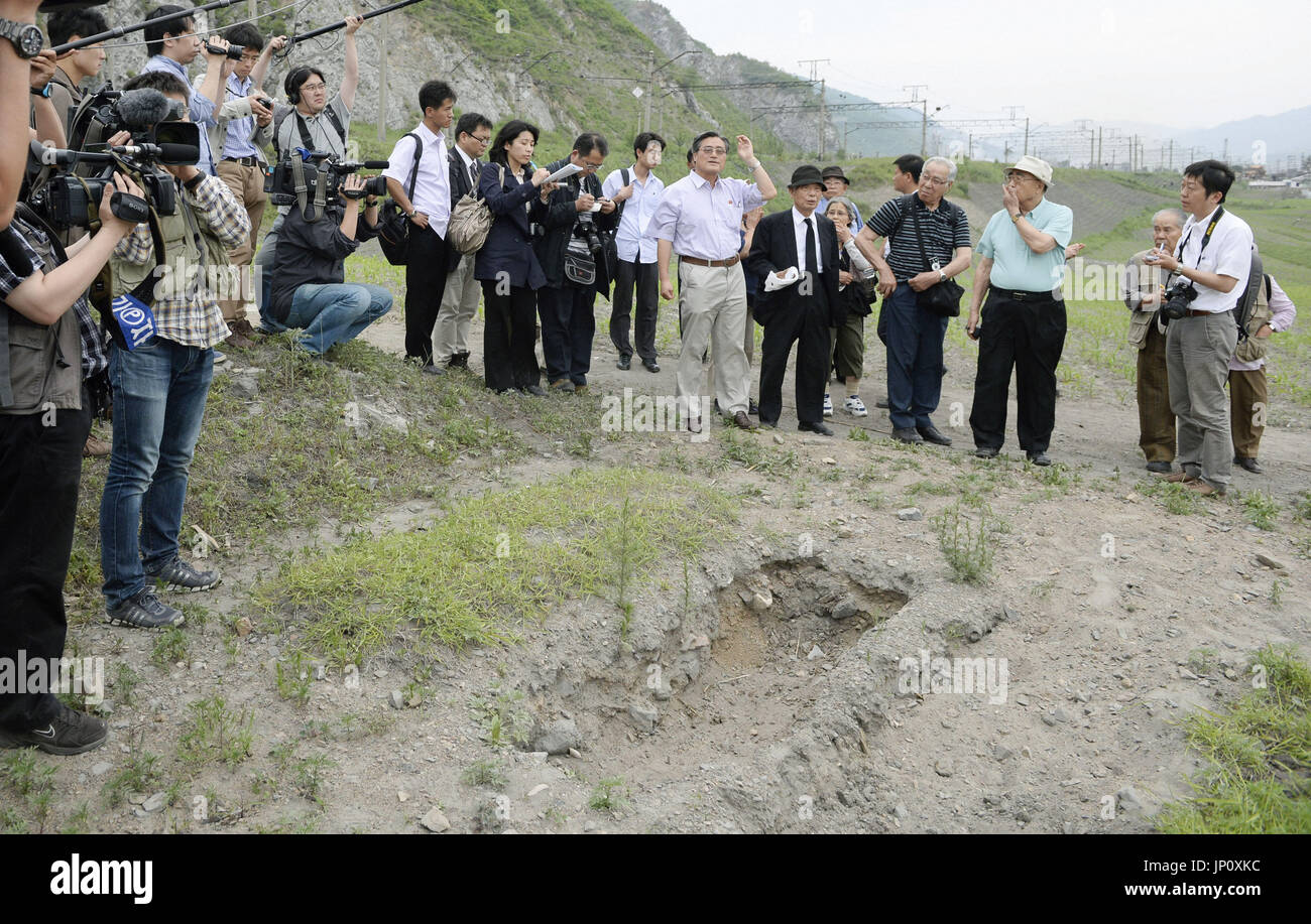 CHONGJIN, North Korea - Bereaved family members and reporters visit ...