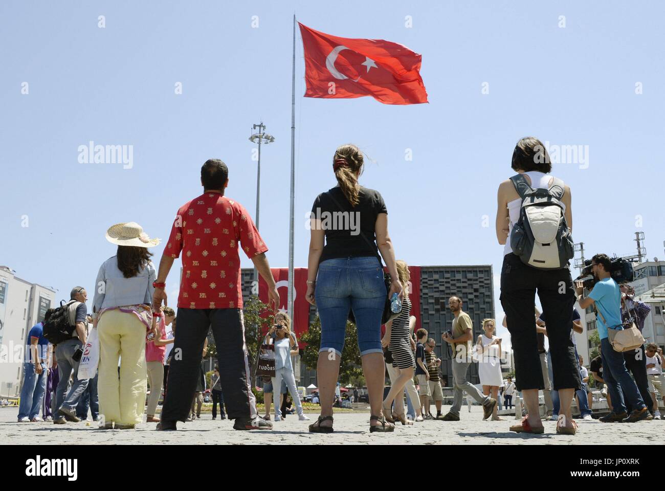 ISTANBUL, Turkey - People remain standing in Taksim Square as part of ...