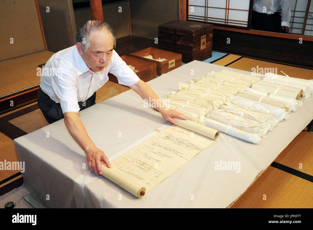 KYOTO, Japan - Osamu Nawa, head of the Yomei Bunko library, holds a ...