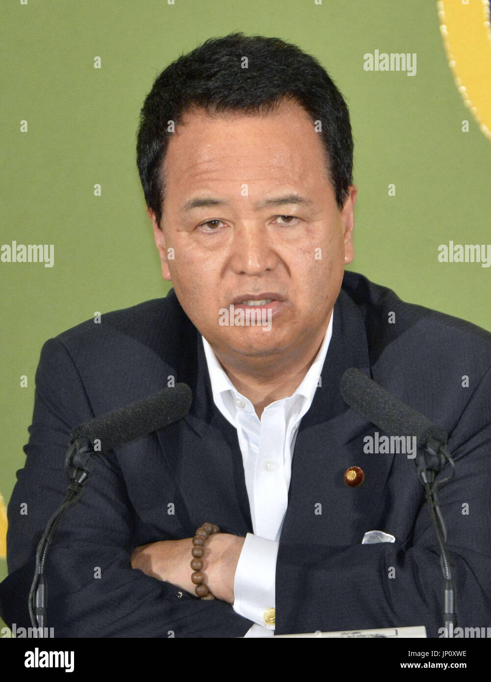 TOKYO, Japan - Economic and fiscal policy minister Akira Amari gives a ...