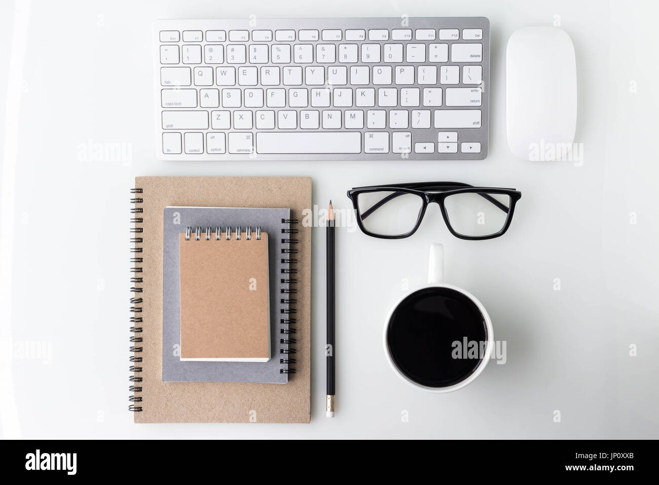 Modern white office desk top table with computer laptop, notebook and ...