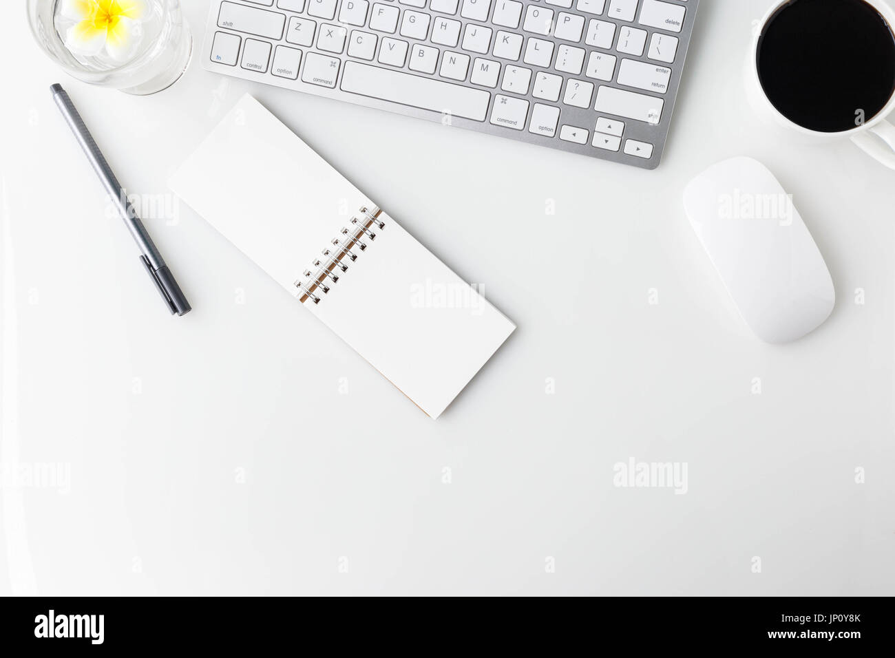 Modern white office desk top table with computer laptop, cup of coffee ...