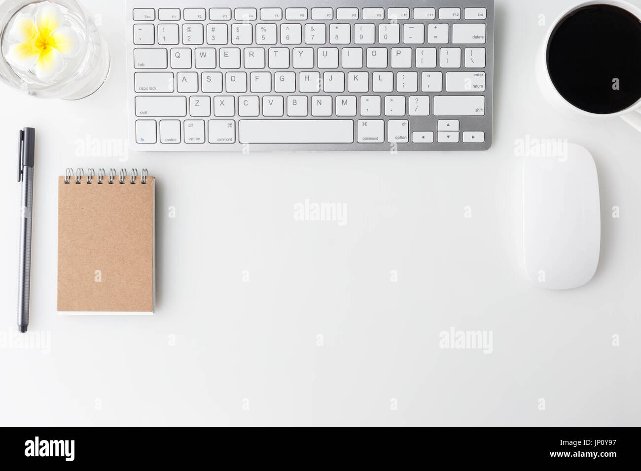 Modern white office desk top table with computer laptop, cup of coffee ...