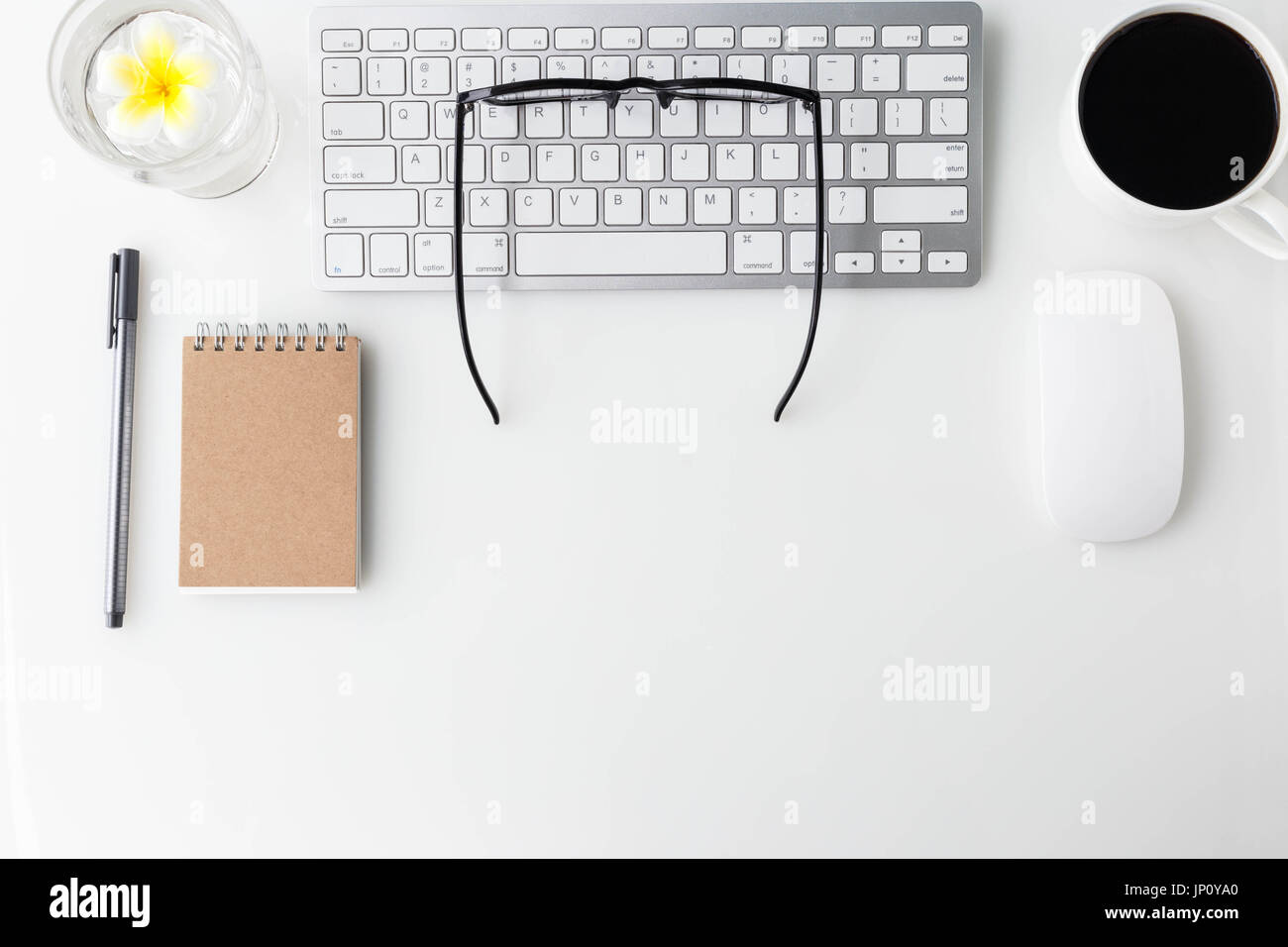 Modern white office desk top table with computer laptop, cup of coffee ...