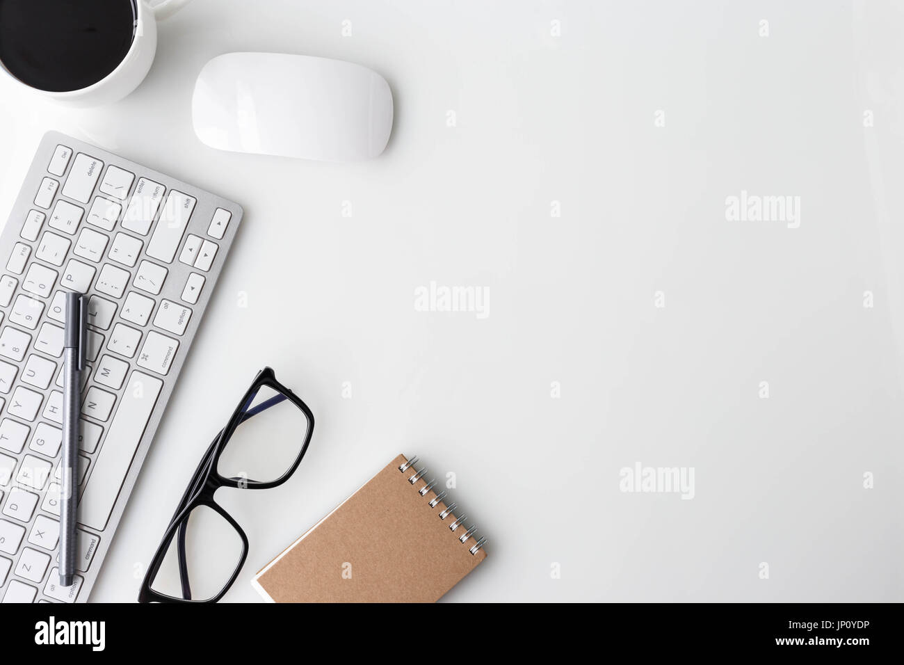 Modern white office desk top table with computer laptop, cup of coffee ...