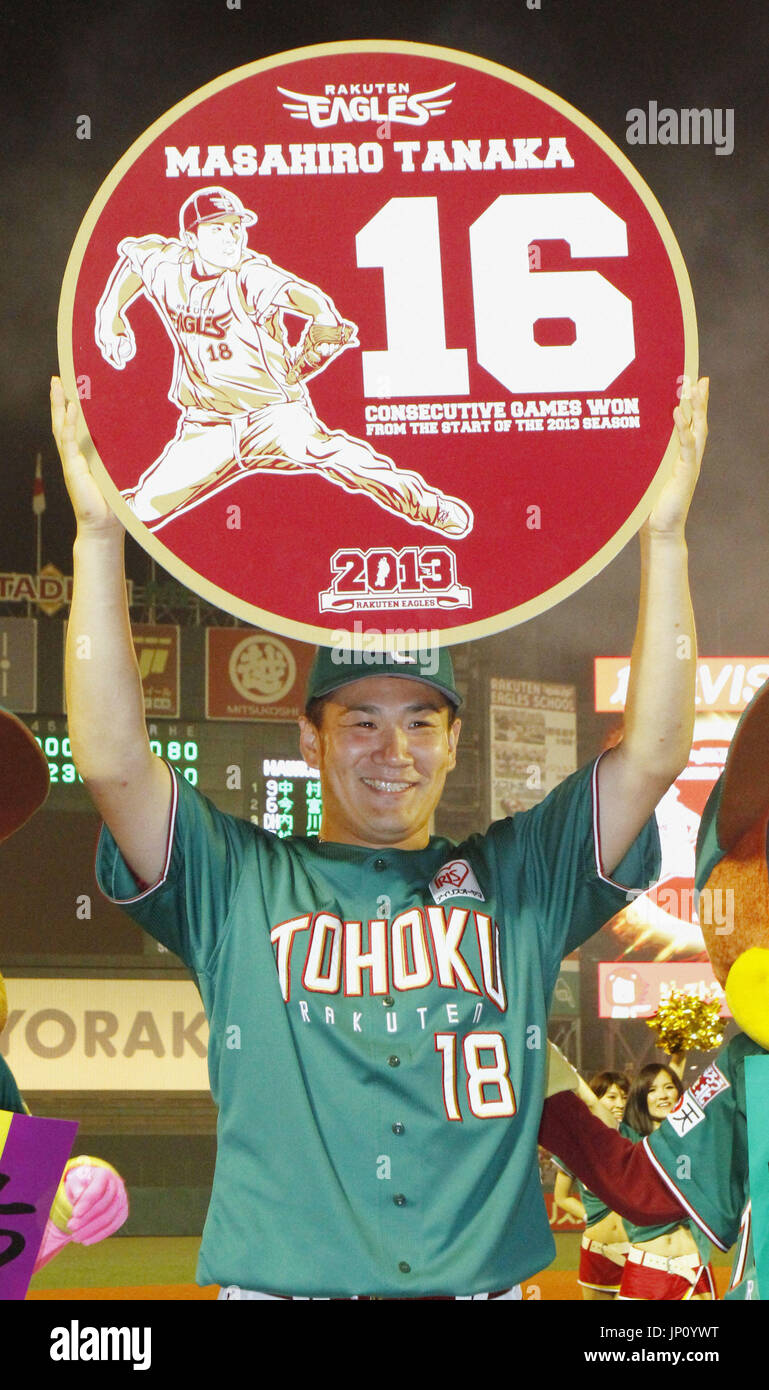 SENDAI, Japan - Rakuten Eagles pitcher Masahiro Tanaka holds a ...