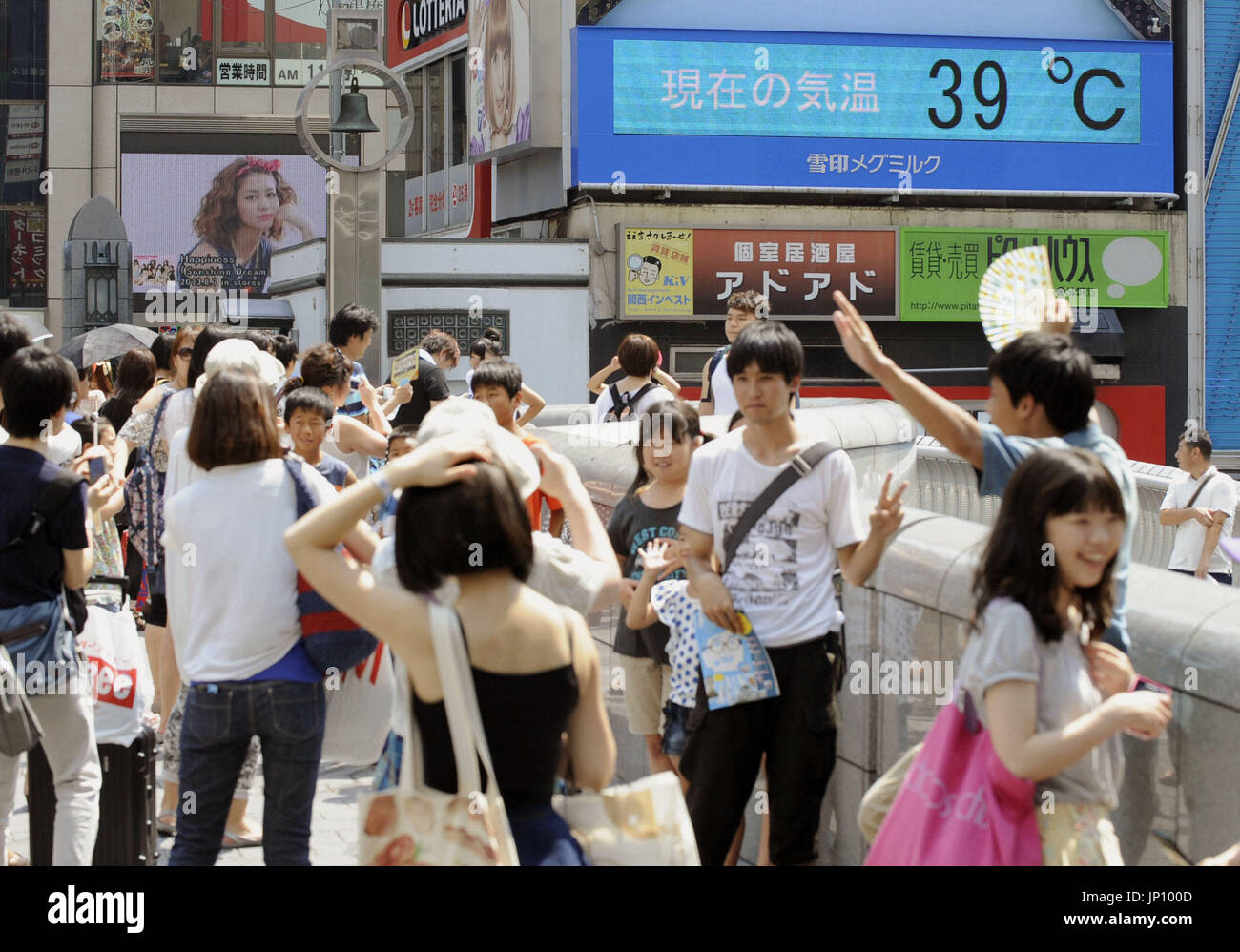 OSAKA, Japan - A signboard displays 39 C at the busy Dotombori area of ...
