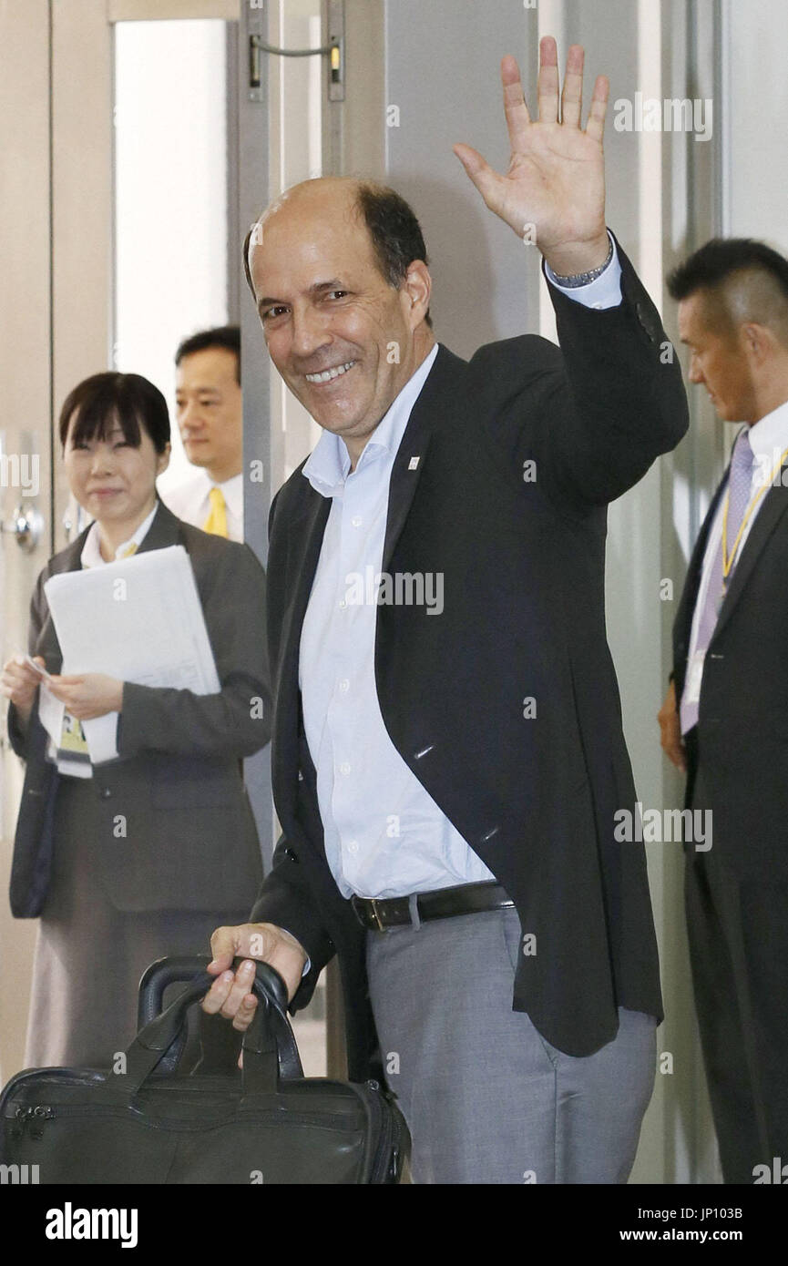 NARITA, Japan - Outgoing U.S. Ambassador to Japan John Roos waves to ...