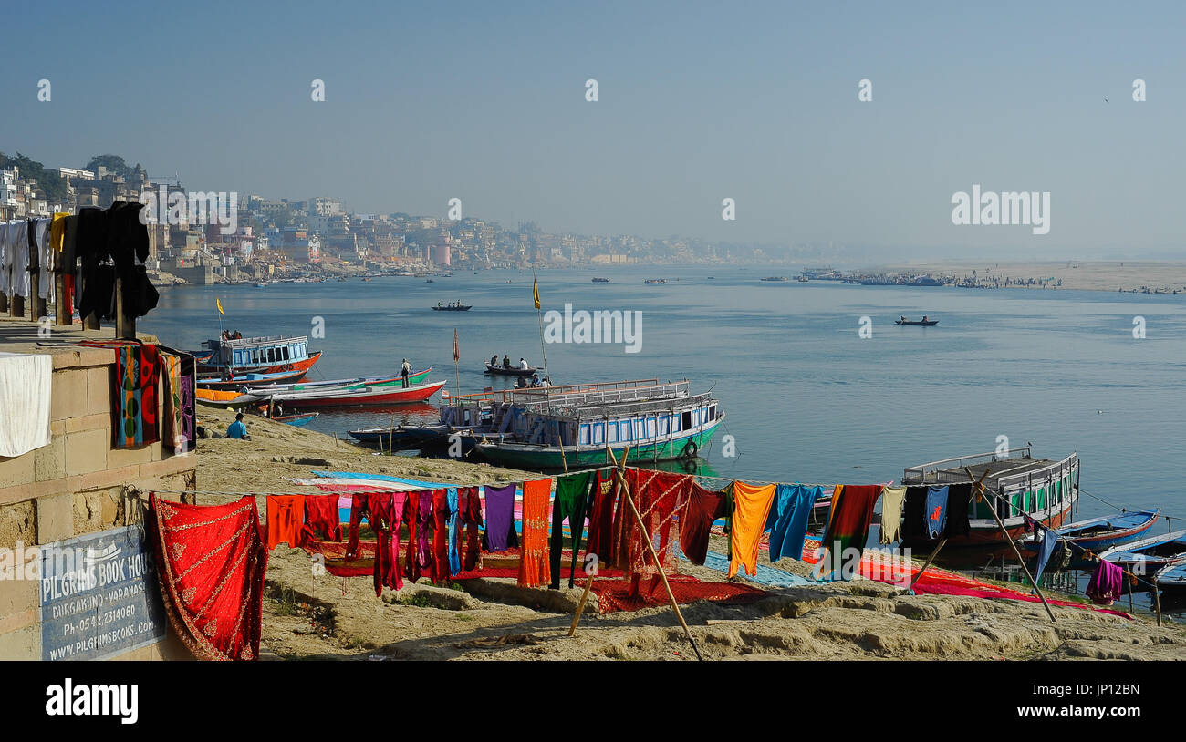 Vibrant clothing hanging to dry beside the Ganges in Varanasi Stock ...