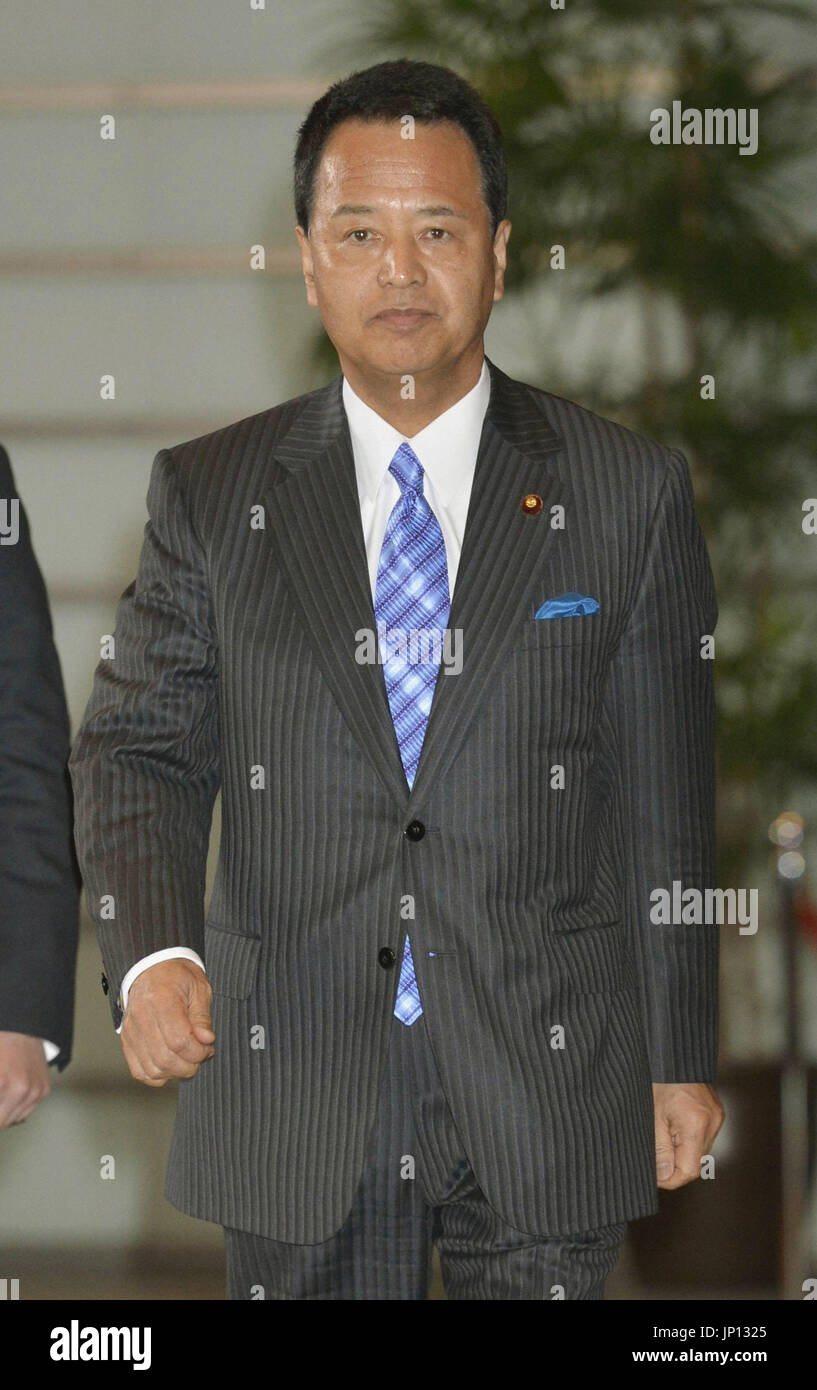 TOKYO, Japan - Akira Amari enters the prime minister's office in Tokyo ...