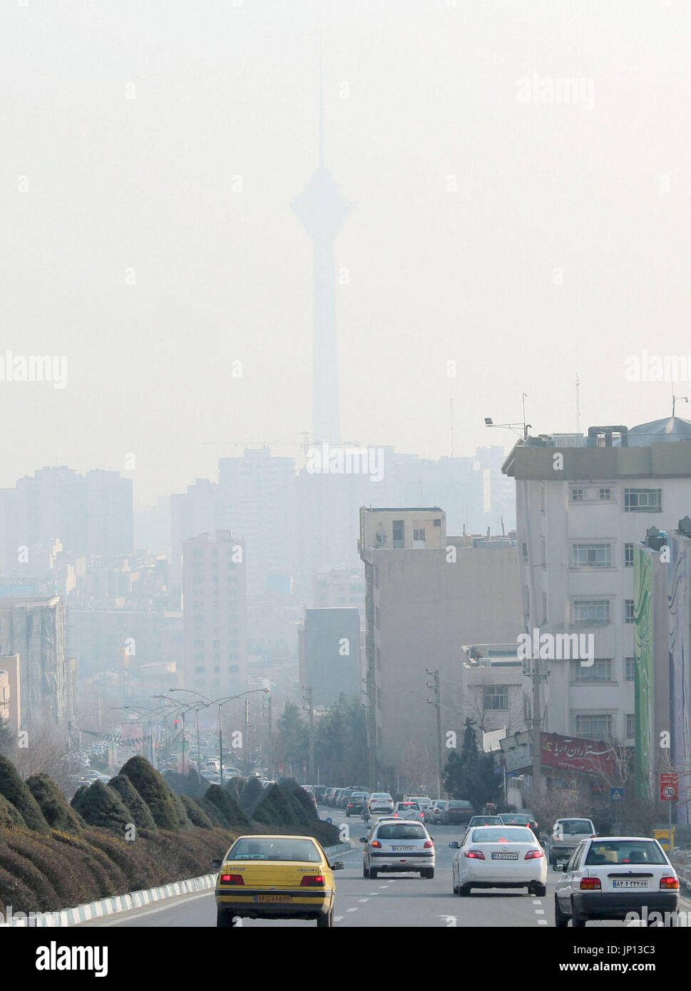 TEHRAN, Iran - The Milad Tower in Tehran is barely visible due to heavy ...