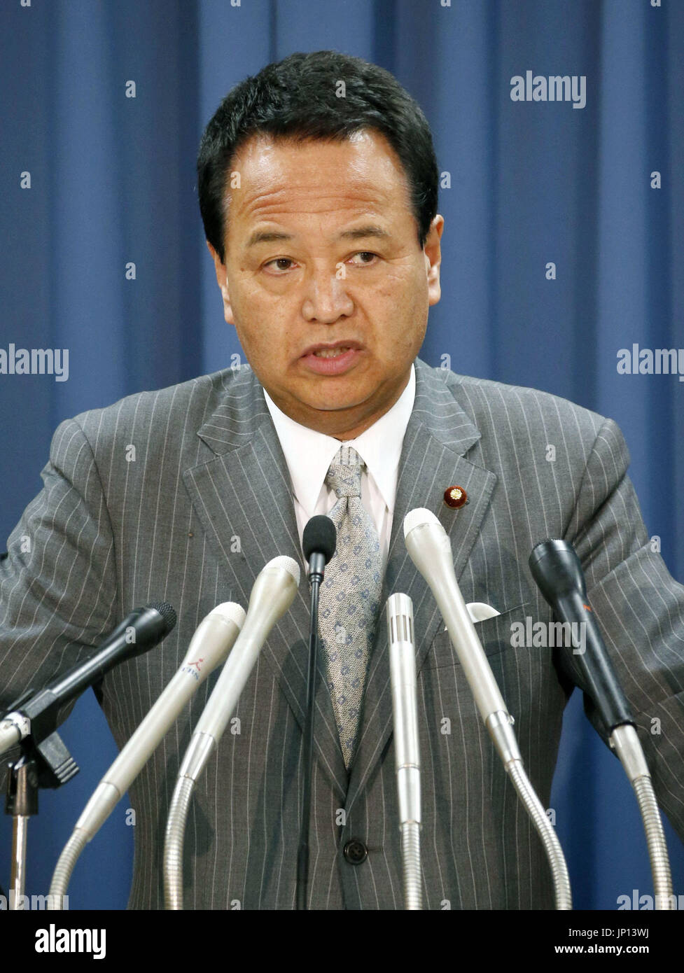 TOKYO, Japan - Economic and fiscal policy minister Akira Amari holds a ...