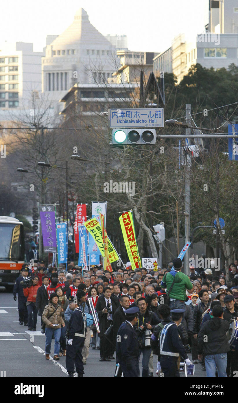 TOKYO, Japan - Protesters march in Tokyo's Uchisaiwaicho district on ...