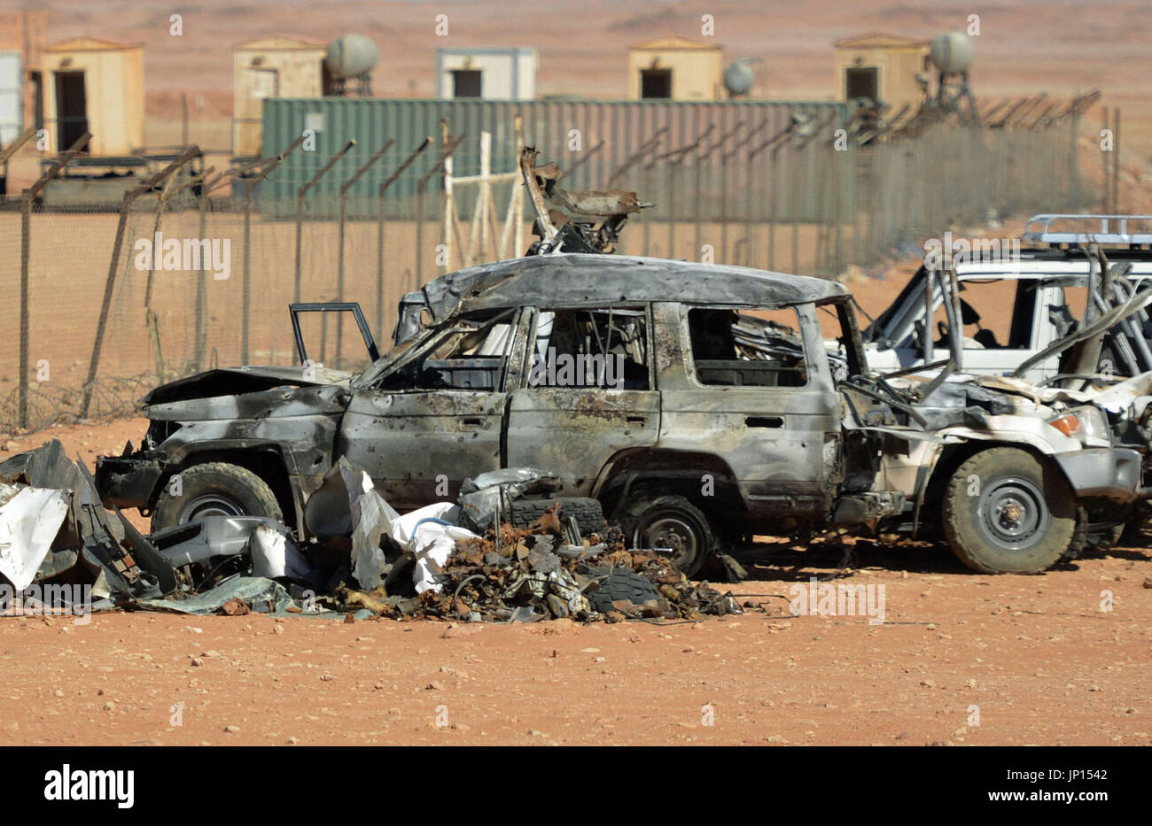 IN AMENAS, Algeria - Photo shows charred vehicles left near a gas ...