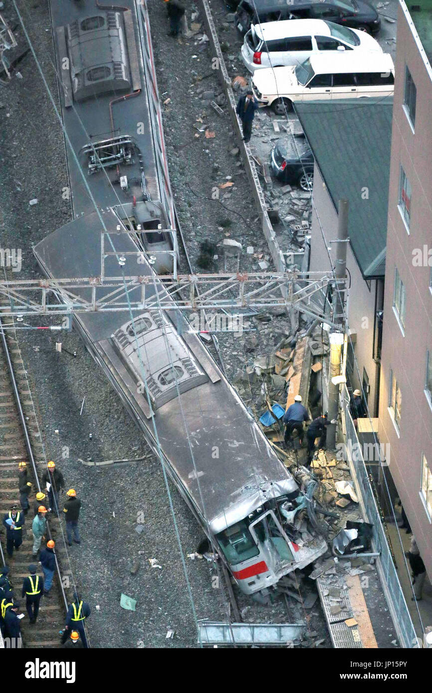 TAKASAGO, Japan - Photo from a Kyodo News helicopter shows a train ...