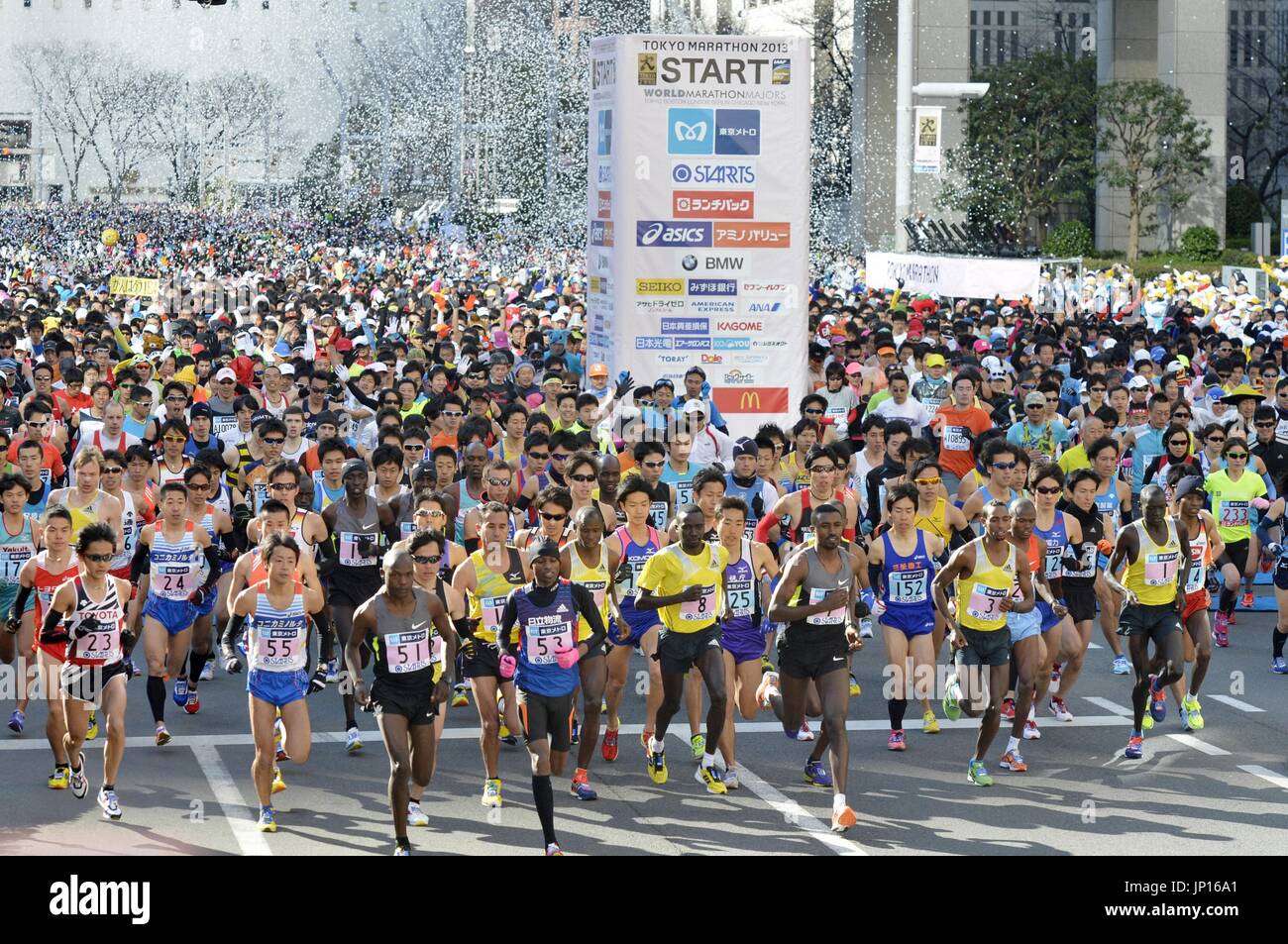 TOKYO, Japan - Showered with confetti, runners in the Tokyo Marathon ...