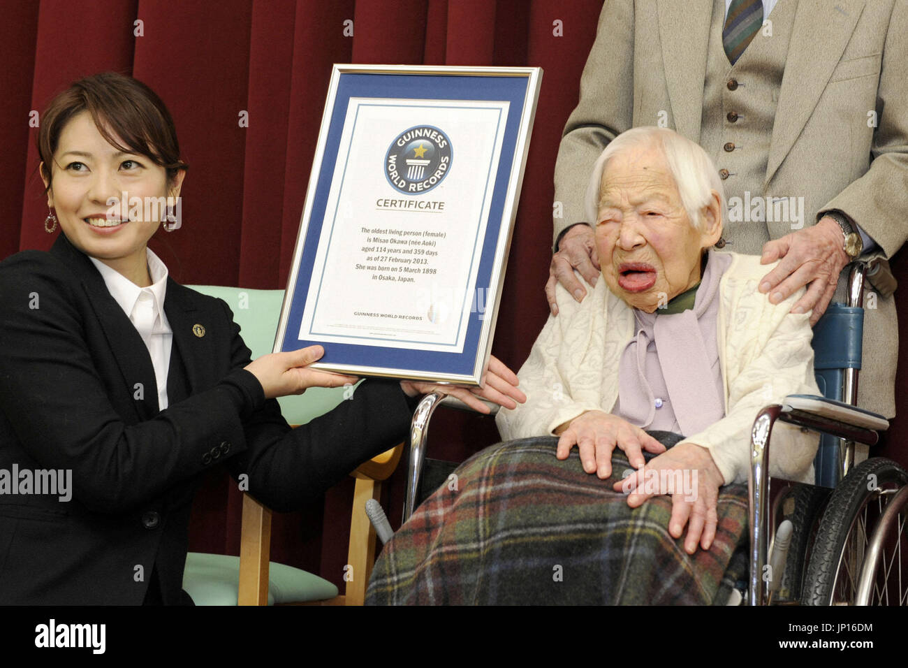 OSAKA, Japan - Misao Okawa (R), aged 114, receives a certificate from ...
