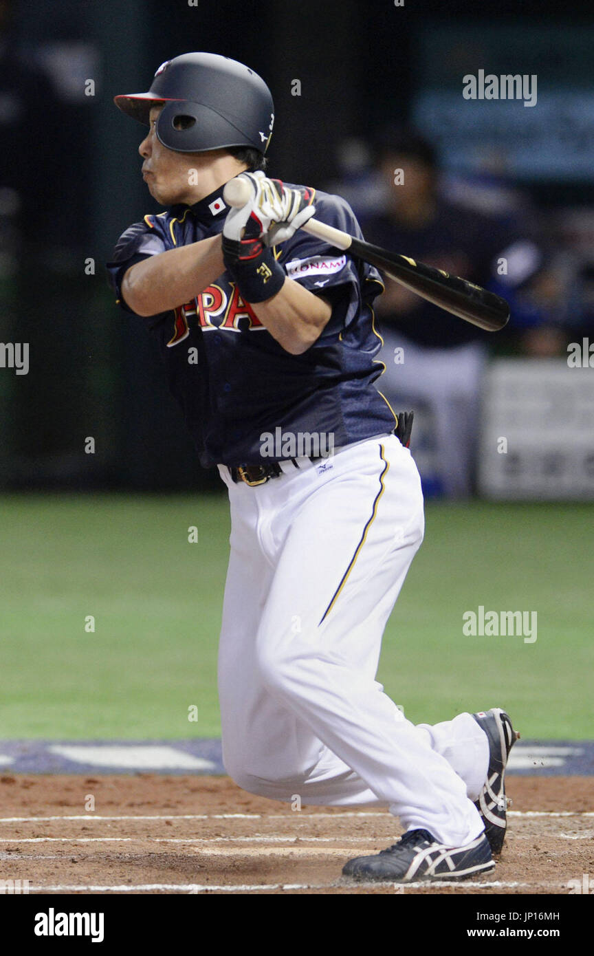 FUKUOKA, Japan - Hirokazu Ibata of Japan hits an equalizer against ...