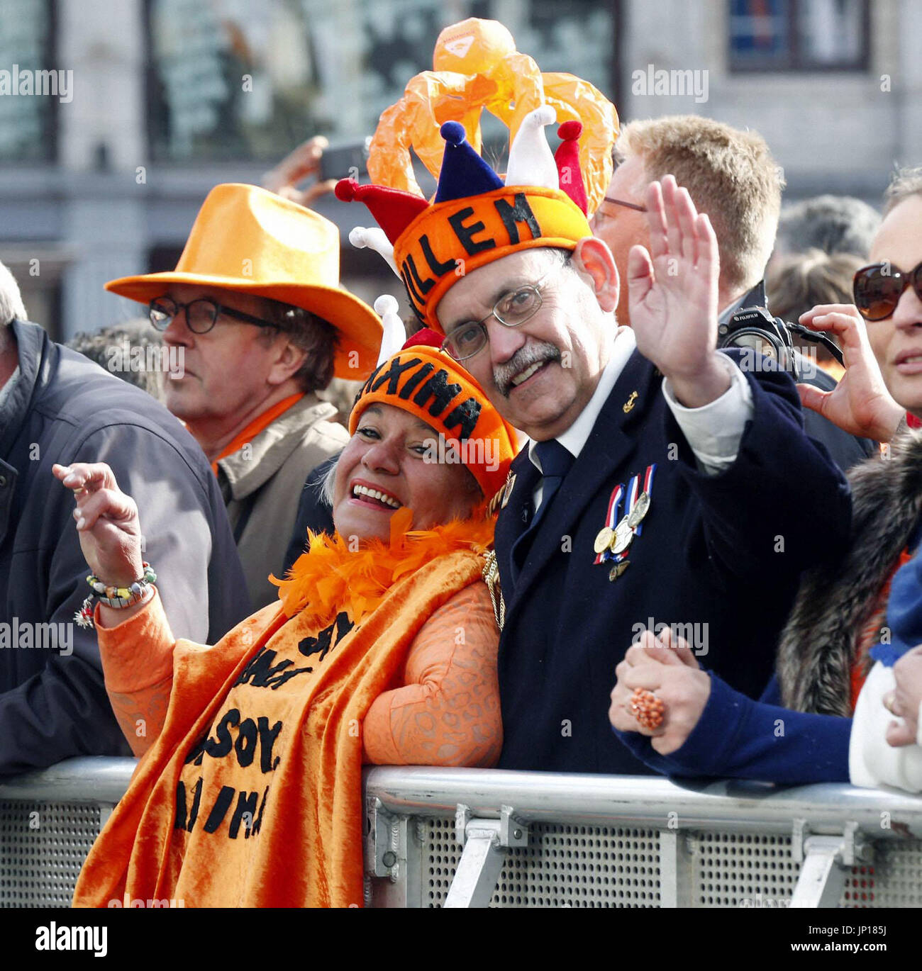 AMSTERDAM, Netherlands - A crowd assembles in front of the royal palace ...